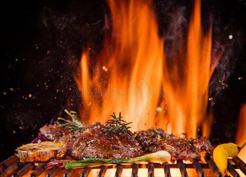 Beef Steaks on the Grill with Flames Stock Image - Image of fire, fork ...