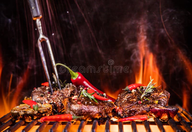 Beef Steaks on the Grill with Flames Stock Photo - Image of cookout ...