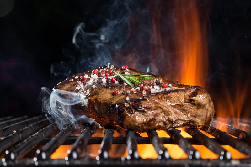 Beef Steaks on the Grill with Flames Stock Photo - Image of glowing ...