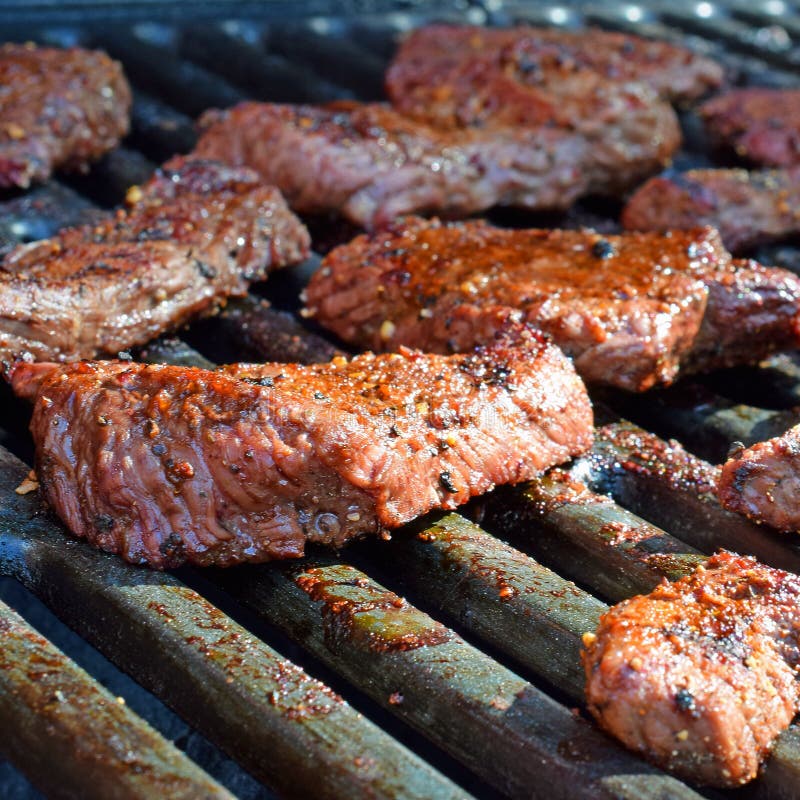 Beef steaks on the grill. stock photo. Image of space - 97144010