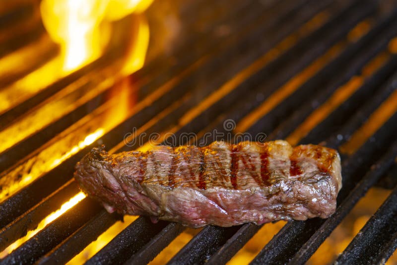 Beef Steaks on the Grill with Fire Flames Stock Image - Image of braai ...