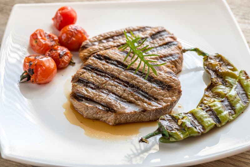 Beef Steaks on the White Square Plate Stock Photo - Image of fillet ...