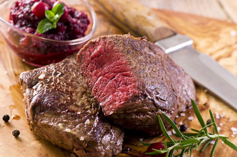 Beef Steaks on Wooden Board Stock Photo - Image of medium, beefsteak ...