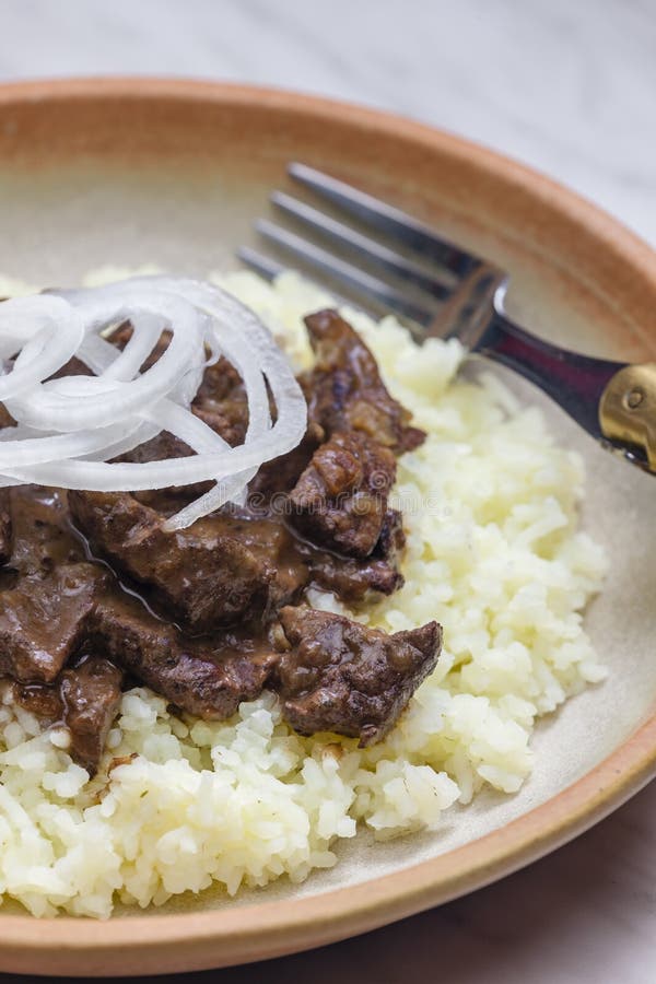 Beef Stew with Rice and Onion Rings Stock Photo - Image of cooked ...