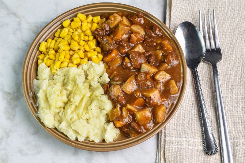 Beef Stew with Corn and Buttered Mash Potatoes Stock Photo - Image of ...