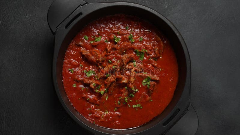 Beef Stew with Tomato Sauce, Spices and Herbs in a Pan Stock Photo ...