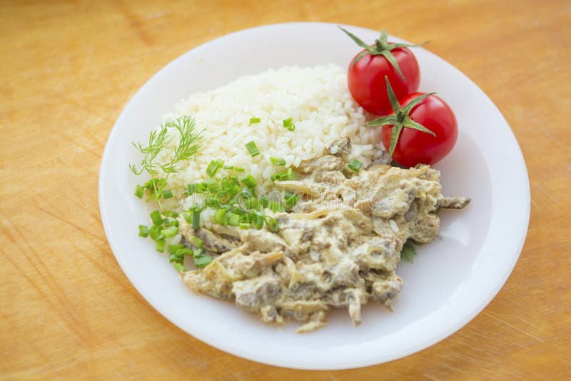 Beef Stroganoff with Rice, Tomatoes and Greens. Stock Photo - Image of ...