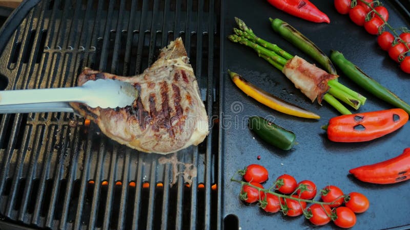 T-bone Steak on Barbecue Grill at Restaurant Stock Footage - Video of ...