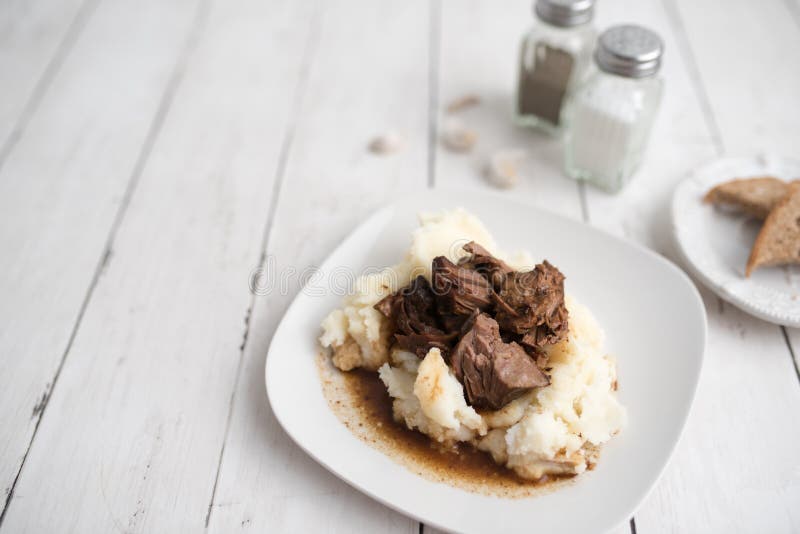 Beef Tips with Gravy on Mashed Potatoes Stock Photo - Image of ...