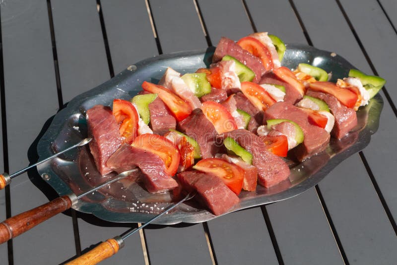 Beef brochettes on a dish stock photo. Image of dish - 235763574