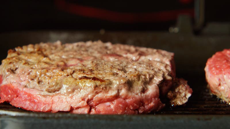 Beefsteaks Frying on a Grill - Front View Stock Image - Image of ...