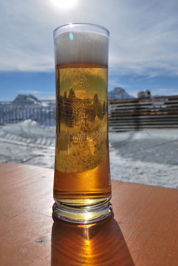 Skiing Resort. Glasses of Beer and a Ski Helmet. Stock Photo - Image of ...