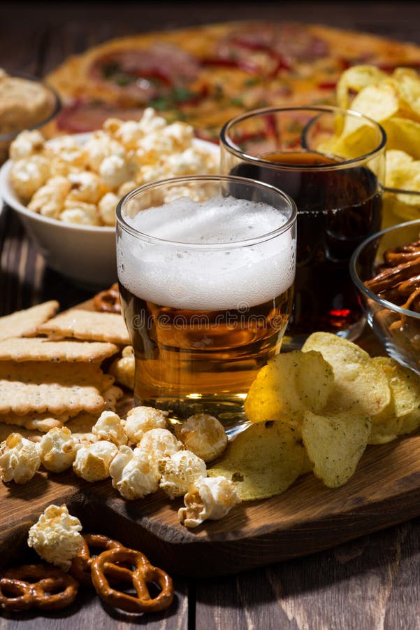 Beer and an Assortment of Snacks, Vertical Stock Photo - Image of ...