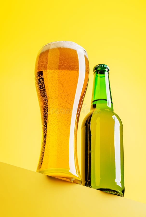 Beer Bliss: Refreshing Brew Against a Vibrant Yellow Backdrop Stock ...