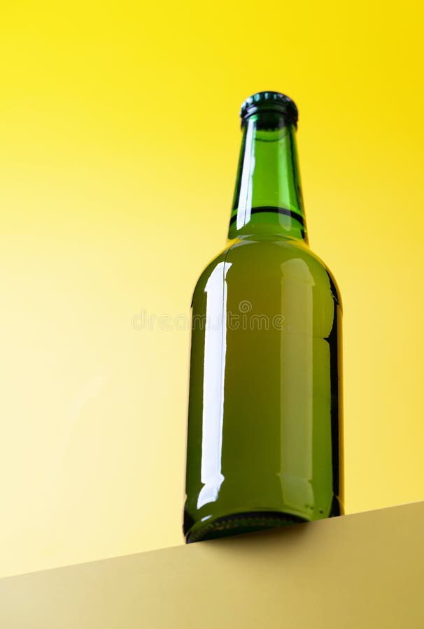 Beer Bliss: Refreshing Brew Against a Vibrant Yellow Backdrop Stock ...