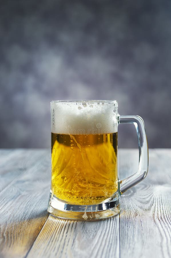 Beer On A Blue Background With Cashew Nuts. Stock Image - Image of ...