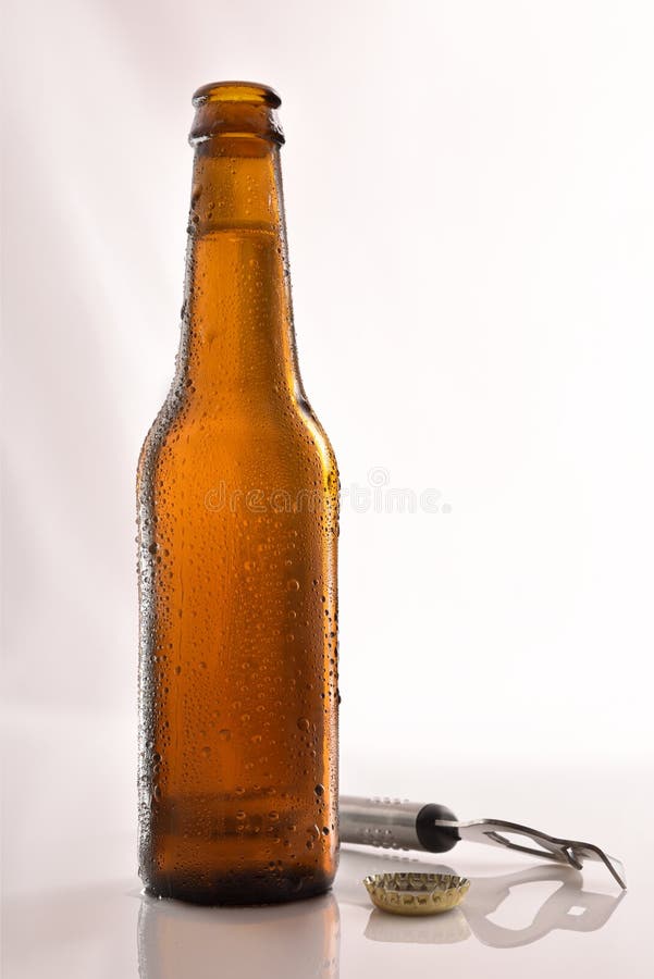 Beer Bottle Filled and Open on Glass Table Black Background Stock Image ...