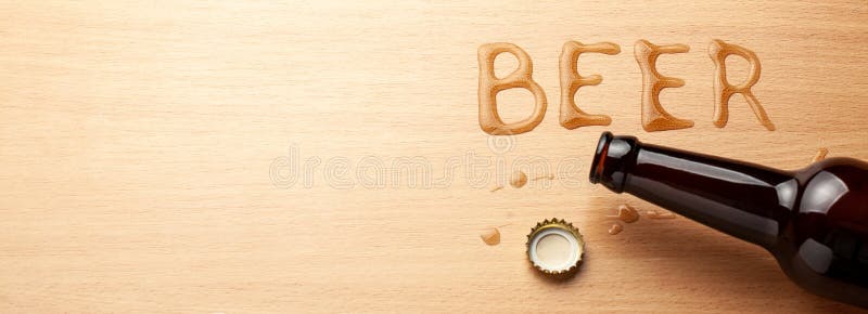 Beer Bottle and Spilled Drink on the Table. Copy Space for Text. Stock ...
