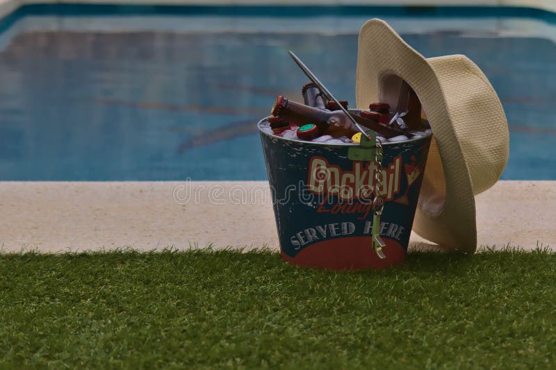 Beer Bottles in a Bucket with Ice by the Pool Stock Photo - Image of ...