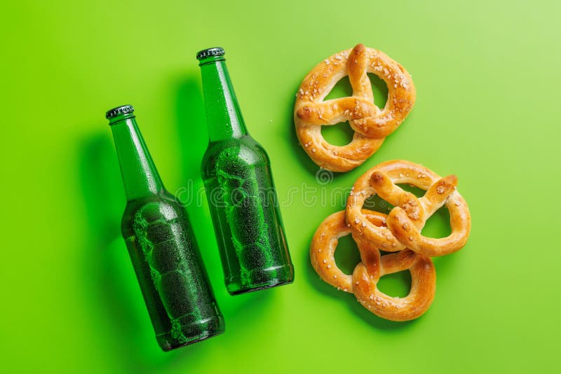 Beer Bottles and Pretzels on Green Background Stock Photo - Image of ...
