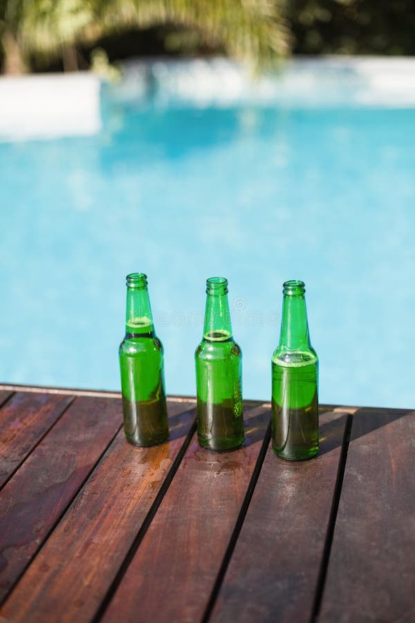 Beer Bottles on Wooden Panel Stock Image - Image of outdoors, people ...