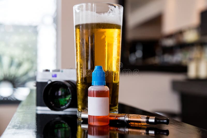 Beer, Camera, Vaping Juice and Vaporizer Stock Photo - Image of ...