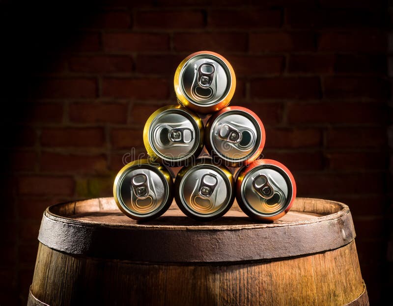Beer Cans Stacked into a Pyramid Shape on a Vintage Barrel in a Dimly ...