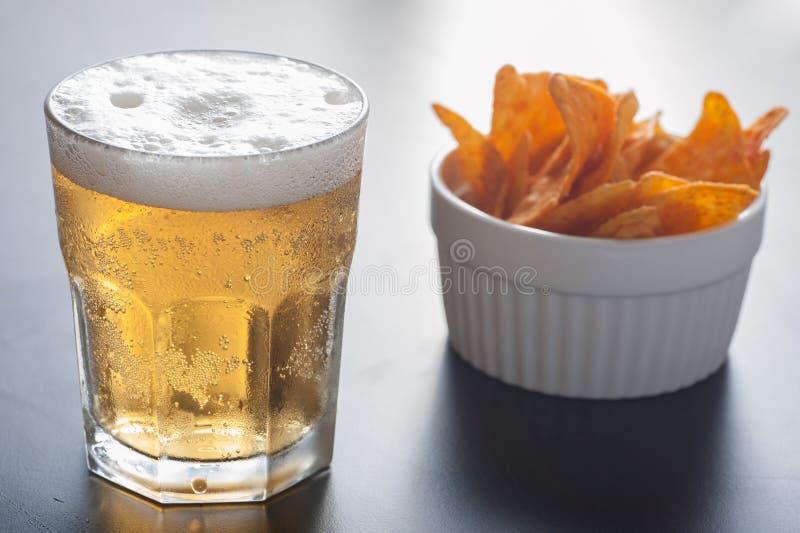 Beer and Chips stock image. Image of gold, alcohol, bubble - 51352105