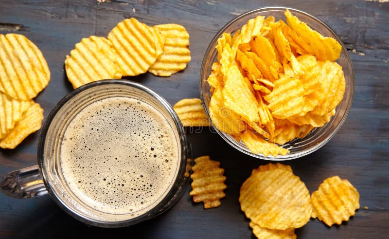 Beer with chips stock image. Image of spicy, board, salt - 67012199