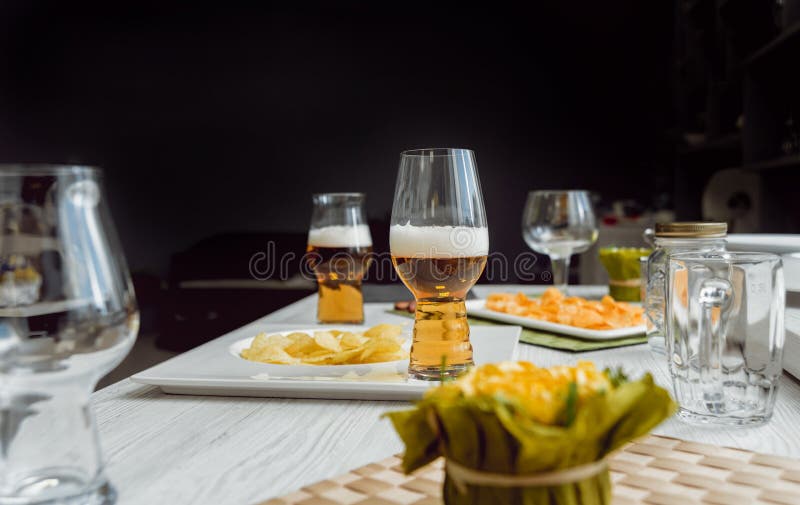Beer and Chips on the Large White Table Stock Image - Image of indoors ...