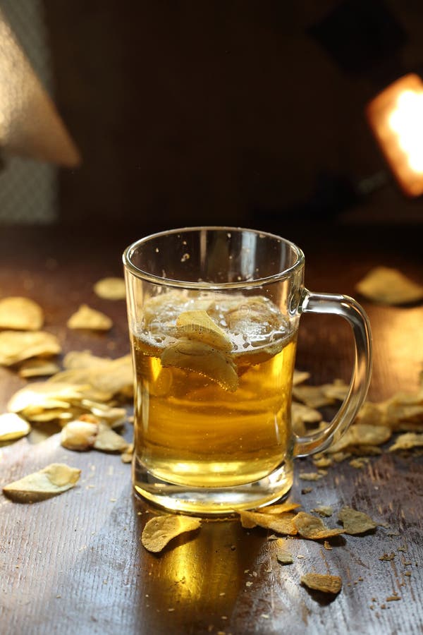 Beer with Chips on a Wooden Background Stock Image - Image of french ...