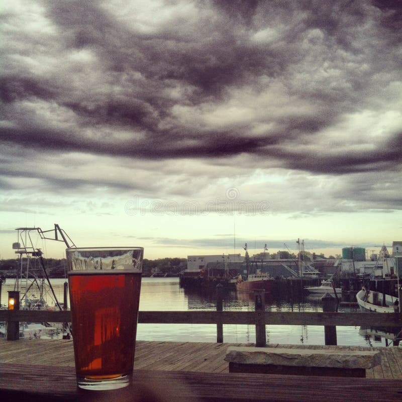 Beer on the dock editorial photography. Image of stratus - 62478862