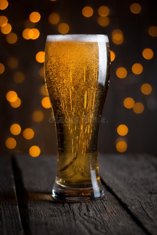 Beer in Glass on Dark Table Stock Photo - Image of bubbles, path: 136981580