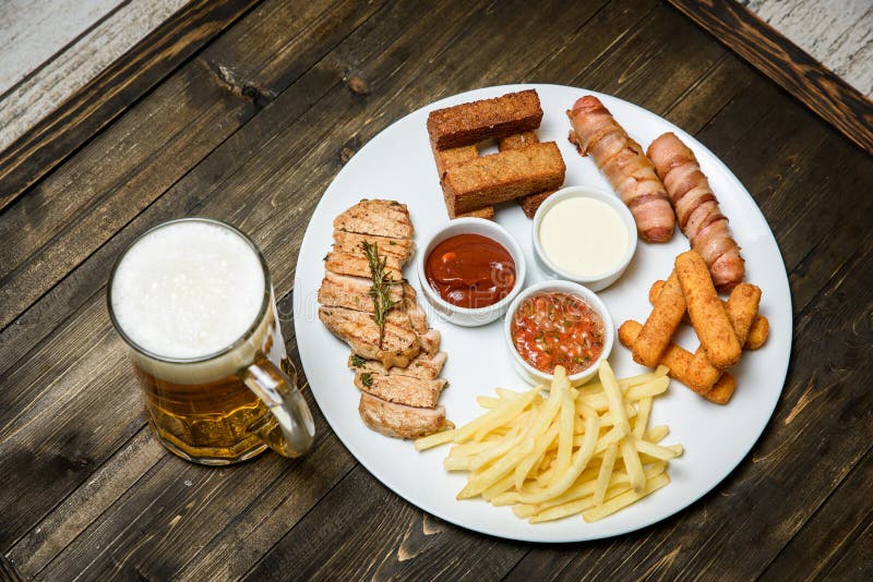 Beer in a Glass on Wooden Background. and Snack. Stock Image - Image of ...