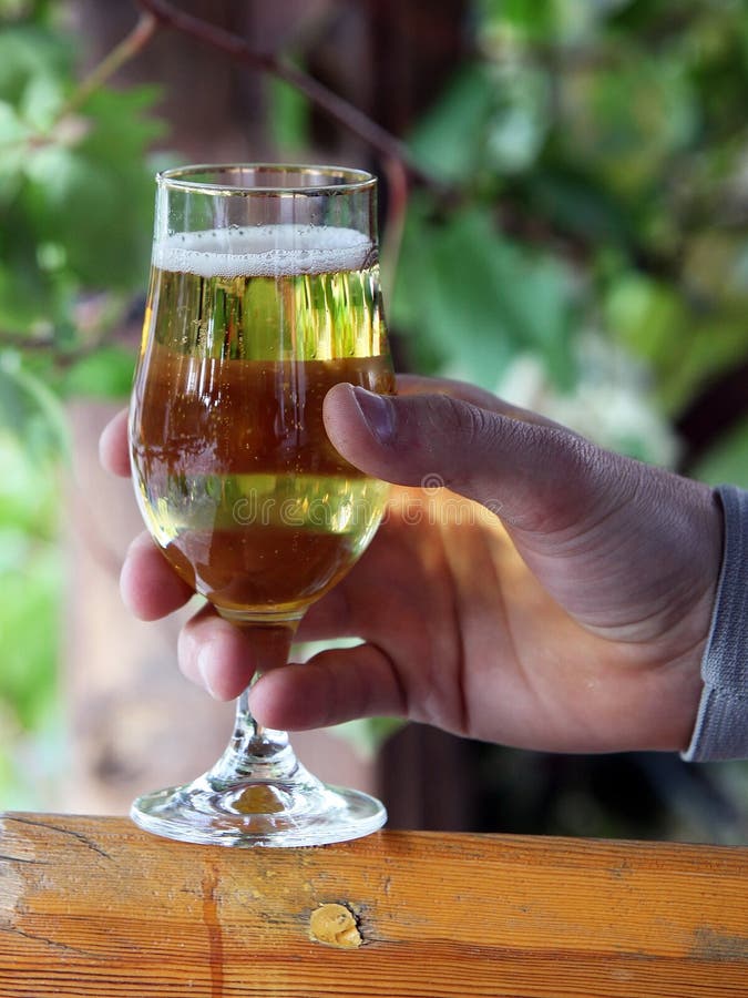 Beer in hand stock photo. Image of desk, celebration - 11753166