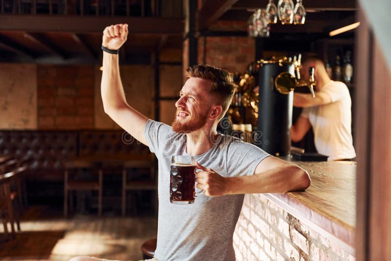 With Beer. Man in Casual Clothes Sitting in the Pub Stock Photo - Image ...