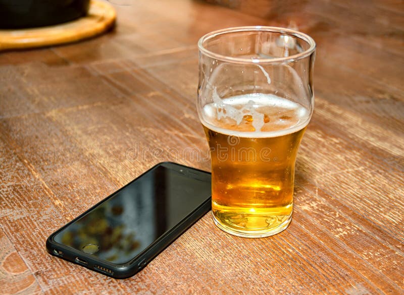 Beer and mobile stock photo. Image of technology, gold - 237078220