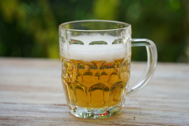 Beer Mug on the Table with Beer. Pilsner Lager Golden Beer Stock Image ...