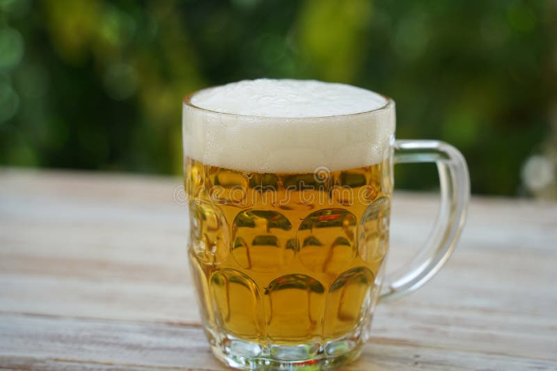 Beer Mug on the Table with Beer. Pilsner Lager Golden Beer Stock Photo ...