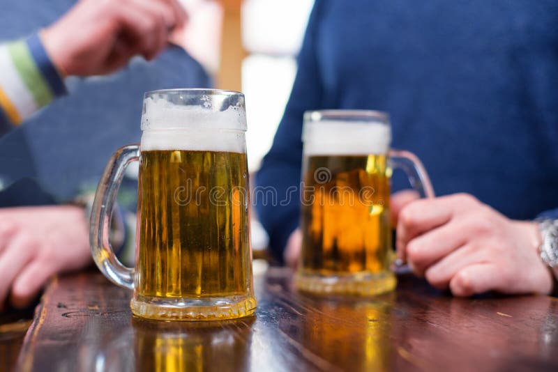 Beer pint on wooden table stock photo. Image of drinking - 87751310