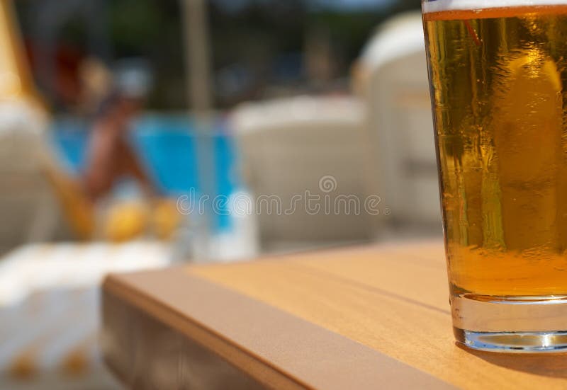 Beer at pool stock photo. Image of drink, foam, pool, beer - 801388