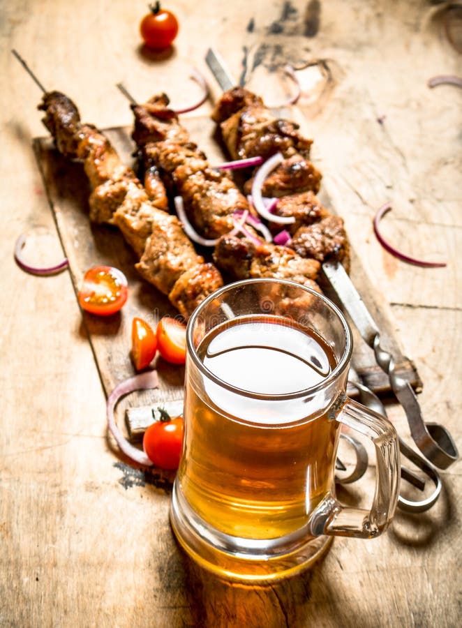 Beer with Pork Shish Kebab and Tomatoes. Stock Photo - Image of ...