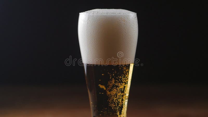 Beer Is Pouring Into Glass On White Background Slow Motion Stock Video