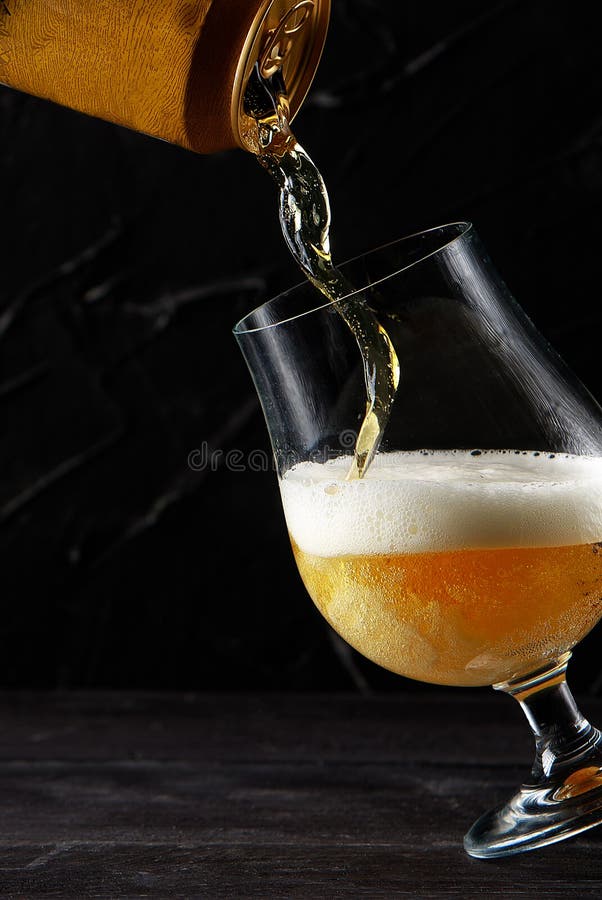 Beer Pouring into a Glass Wooden Table Dark Wall Stock Photo - Image of ...