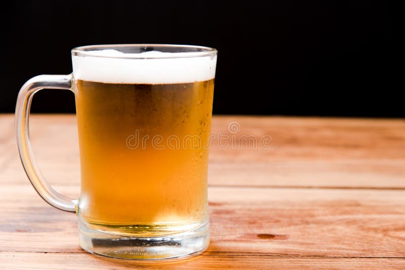 Beer Pouring from Top in Bottle on Wood Table Stock Photo - Image of ...