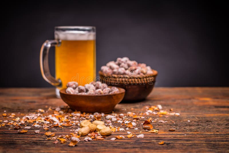 Beer and salted peanuts stock image. Image of salted - 70875919
