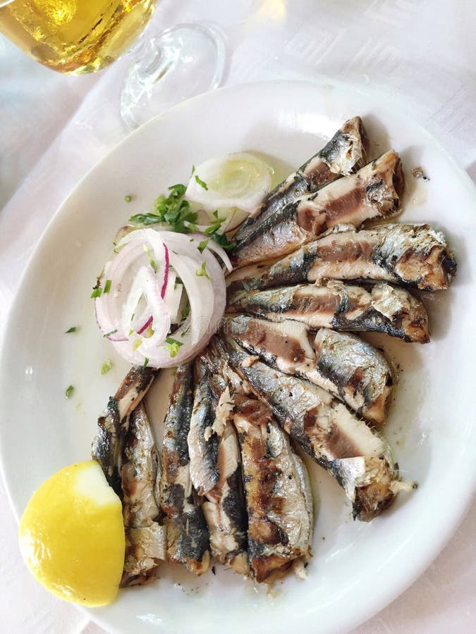 Beer and sardines on table stock image. Image of delicious - 99693921