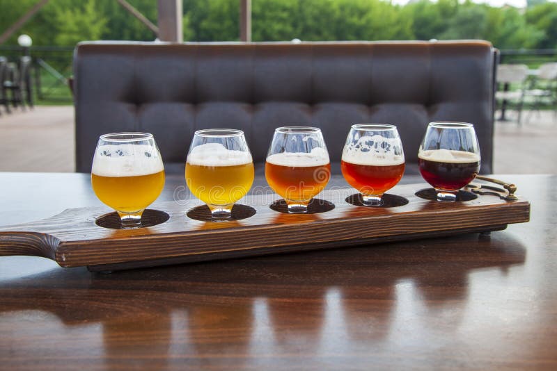 Beer Set, Set of Glasses of Light and Dark Beer on a Pub Background ...