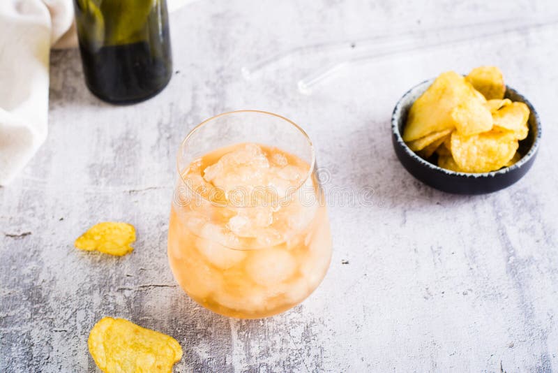 Beer Slush in a Glass and Chips in a Bowl on the Table. Trendy Summer ...