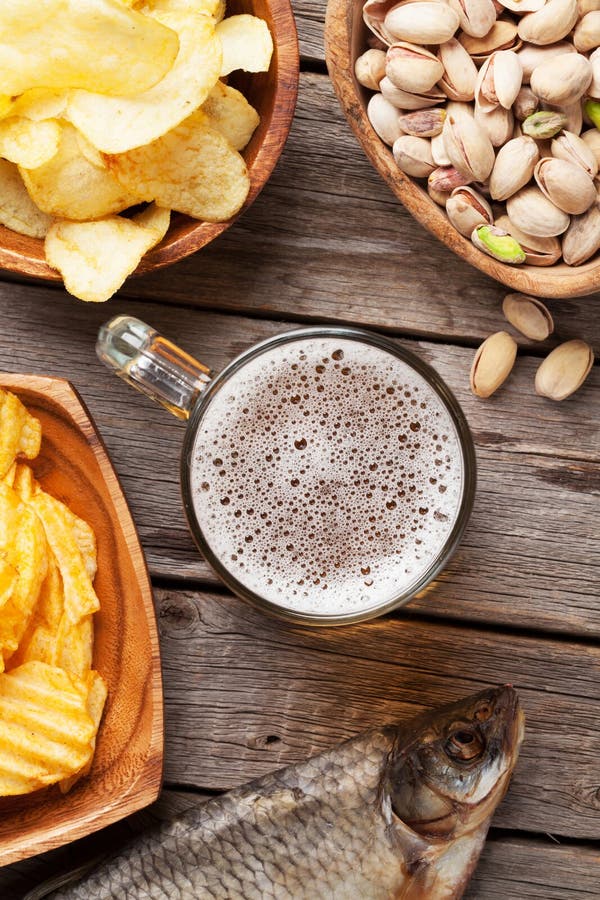 Beer and snacks stock photo. Image of appetizer, pistachio - 94694702